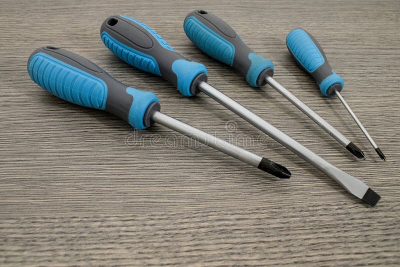 Tools, Set Blue Screwdriver on a Decored Wood Table Stock Photo - Image ...