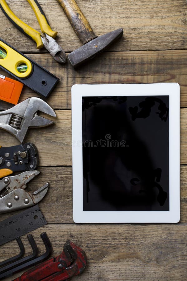 Tools and Tablet on a Wooden Table Stock Image - Image of centimeter ...