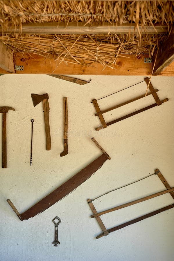 Tools on the Wall of the Hut.Hammer, Saw, Metal and Wood Stock Photo ...