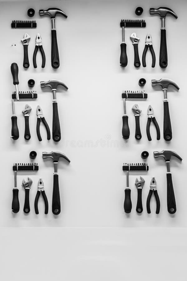 Tools on white wall stock image. Image of industry, hammer - 48478461