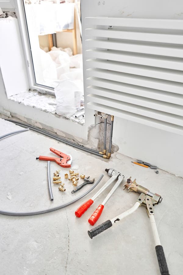 Tools for Work As a Plumber. Connection Heating Pipes To White Radiator ...