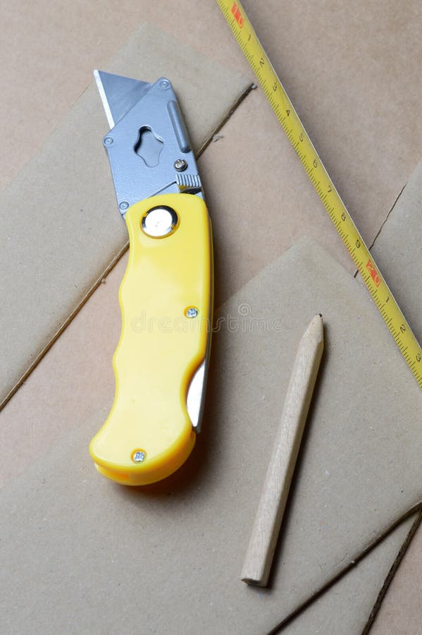 Tools for Working with Cardboard Laid Out on a Table with Cardboard ...