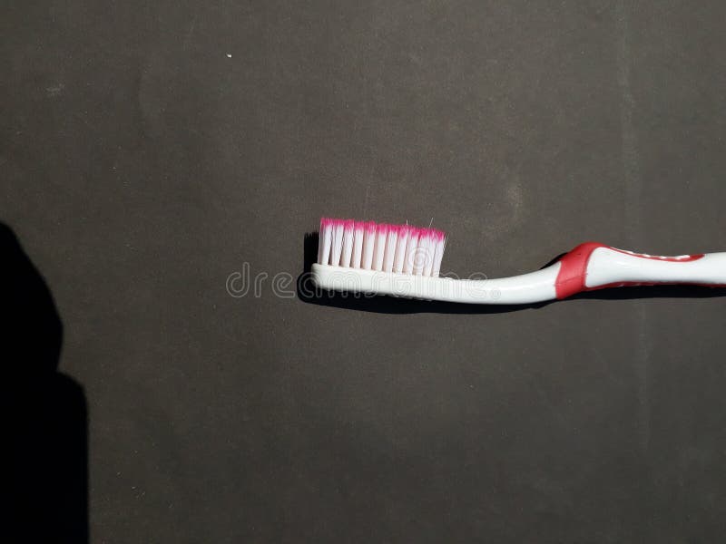 Tooth Brushing is the Act of Scrubbing Teeth with a Toothbrush Equipped ...