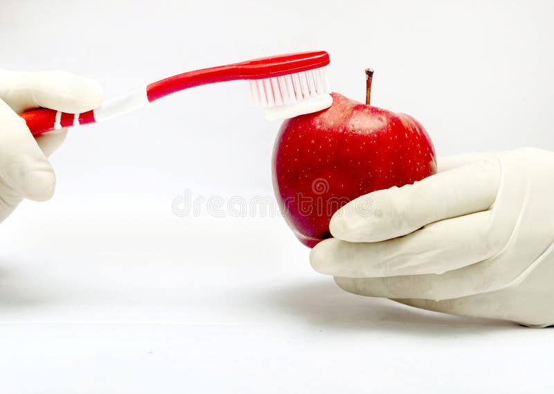 Tooth Brushing Tecnique with Toothpaste and Red Apple Isolated Stock ...