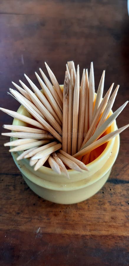 Tooth pick on cup stock photo. Image of tooth, hand - 264670956