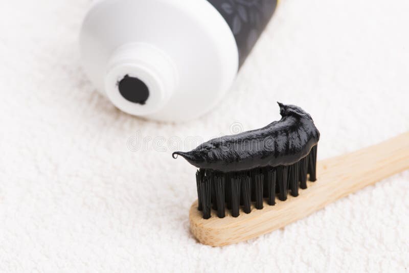 Toothbrush with Black Charcoal Toothpaste Stock Photo - Image of ...
