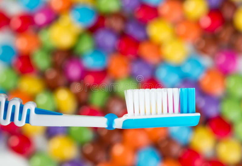 Toothbrush and Chocolate Candies Stock Photo - Image of dental, candy ...