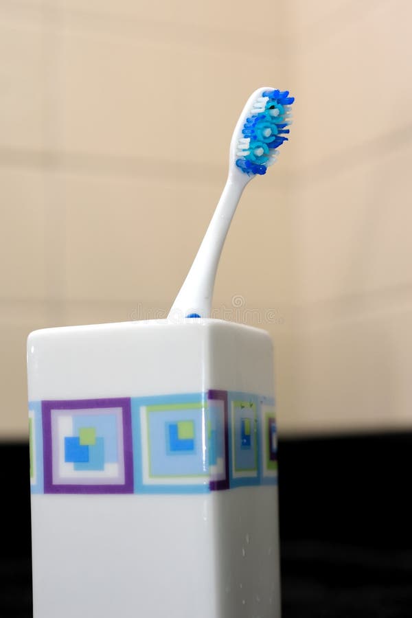 Toothbrush in the cup stock photo. Image of blue, square - 11968904