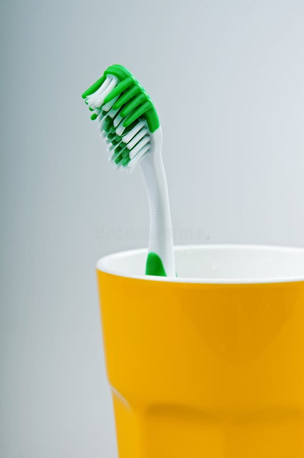 Toothbrush and cup stock image. Image of colors, life - 13018553