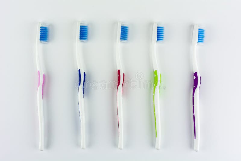 Multi-colored Toothbrushes are Placed on a White Background. Stock ...