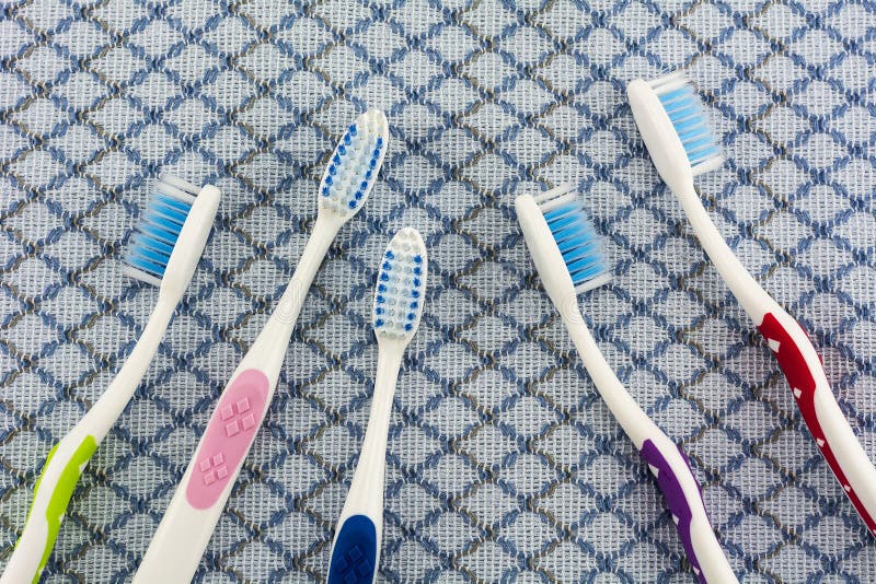 Multi-colored Toothbrushes are Placed Patterned Fabric Backdrop. Stock ...