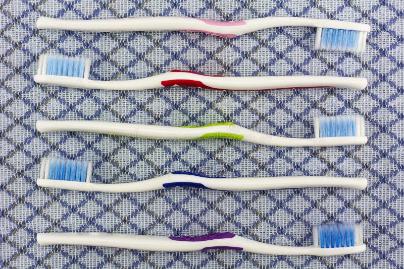 Multi-colored Toothbrushes are Placed Patterned Fabric Backdrop Stock ...