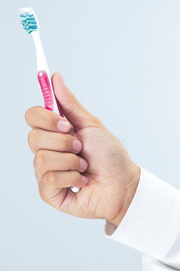 Toothbrush and hand stock image. Image of holding, care - 25869935