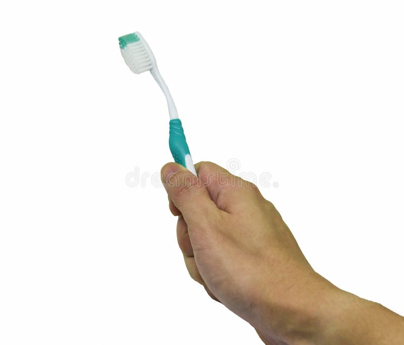Toothbrush in hands stock photo. Image of color, morning - 74224244