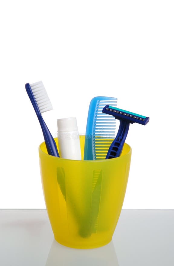 Toothbrush and Razor in Cup Stock Photo - Image of bathroom, comb: 4066910