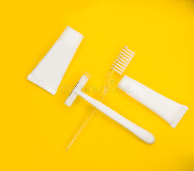 Toothbrush, Razor, Toothpaste, Minimalistic Yellow Background. Stock ...