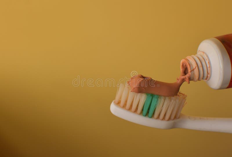 Toothbrush with Red Ayurvedic Toothpaste. Close Up of Red Toothpaste ...
