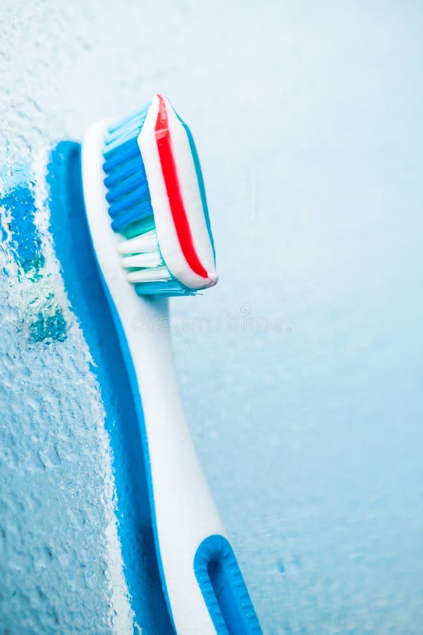 Toothbrush with Red Stripe Toothpaste Stock Photo - Image of macro ...