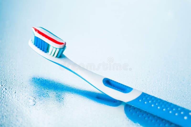 Toothbrush with Red Stripe Toothpaste Stock Photo - Image of closeup ...