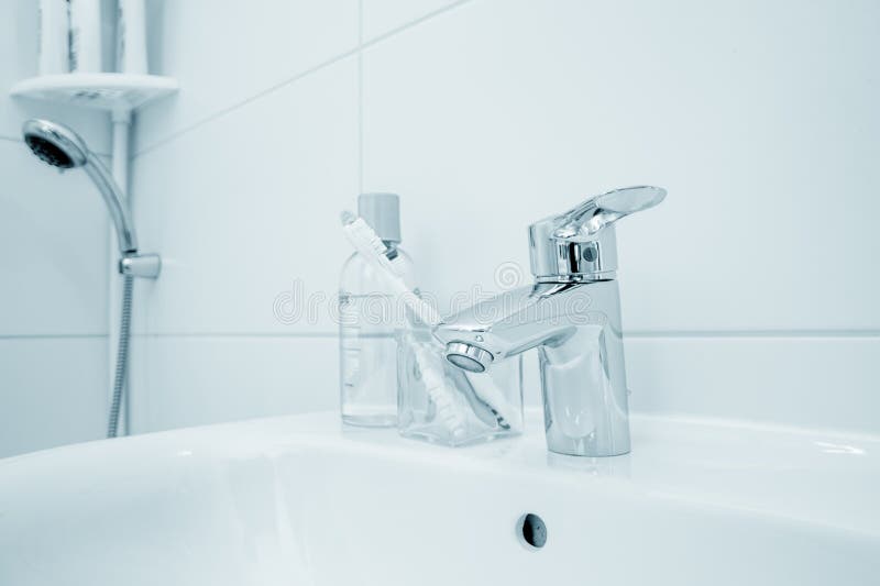 Toothbrush on the Sink in the Bathroom Stock Image - Image of water ...