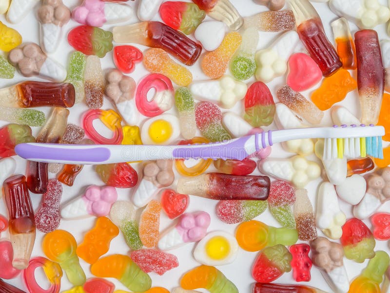 Toothbrush and sweets. stock photo. Image of sweets, sugar - 66247776