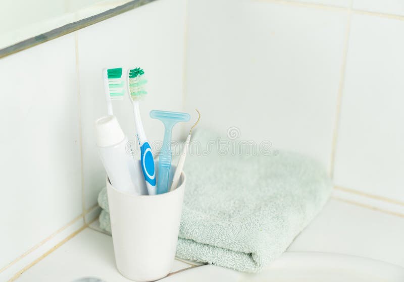 Toothbrush, Toothpaste and Face Towel on Basin in Bathroom Stock Image ...