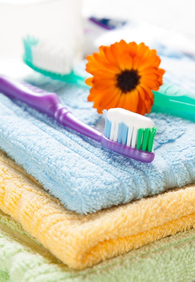 Toothbrush with Toothpaste on Fresh Towels Stock Image - Image of ...