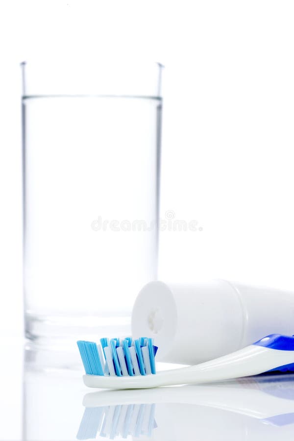 Toothbrush with Toothpaste and Glass of Water Stock Photo - Image of ...