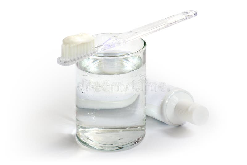 Toothbrush, Toothpaste and a Glass of Water. Stock Image - Image of ...