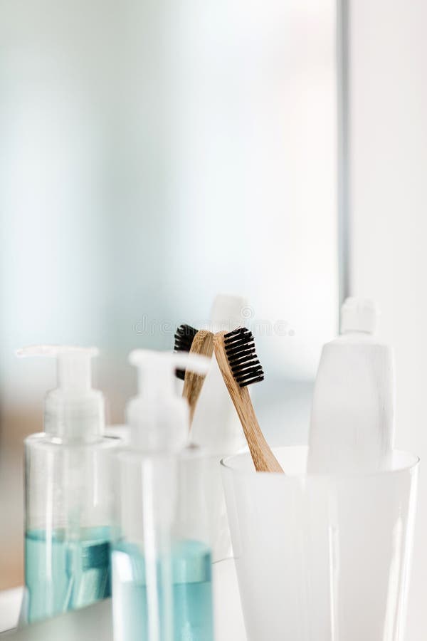 Toothbrush and Toothpaste on Mirror in Bathroom Stock Image - Image of ...