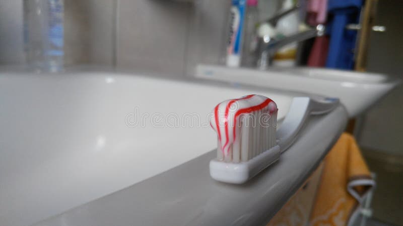 Toothbrush with Toothpaste on a Sink Stock Photo - Image of teeth ...