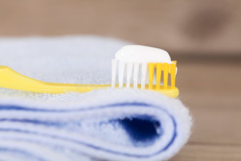 Toothbrush and Toothpaste on the Towel for Washing in the Morning Stock ...
