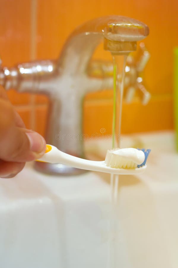 Toothbrush with Toothpaste and Tap with Water Stock Photo - Image of ...