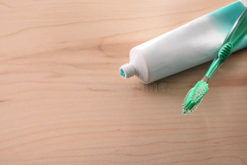 Toothbrush and Toothpaste on Wood Table Dental Hygiene Concept Stock ...