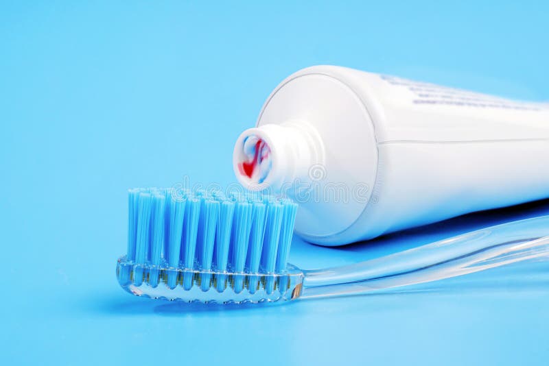 Toothbrush and White Toothpaste Tube on Blue Background Stock Photo ...