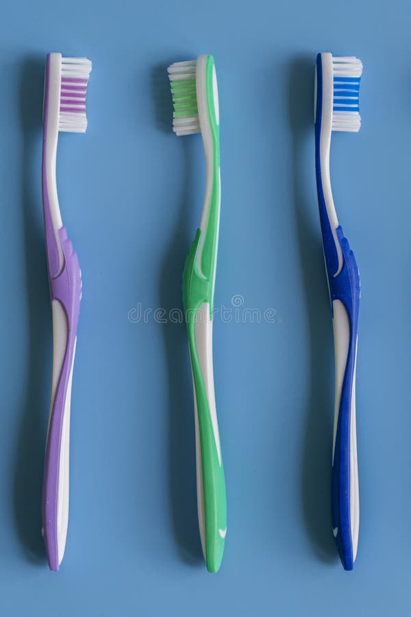 Toothbrushes on Blue Background. Flat Lay Composition with Manual ...