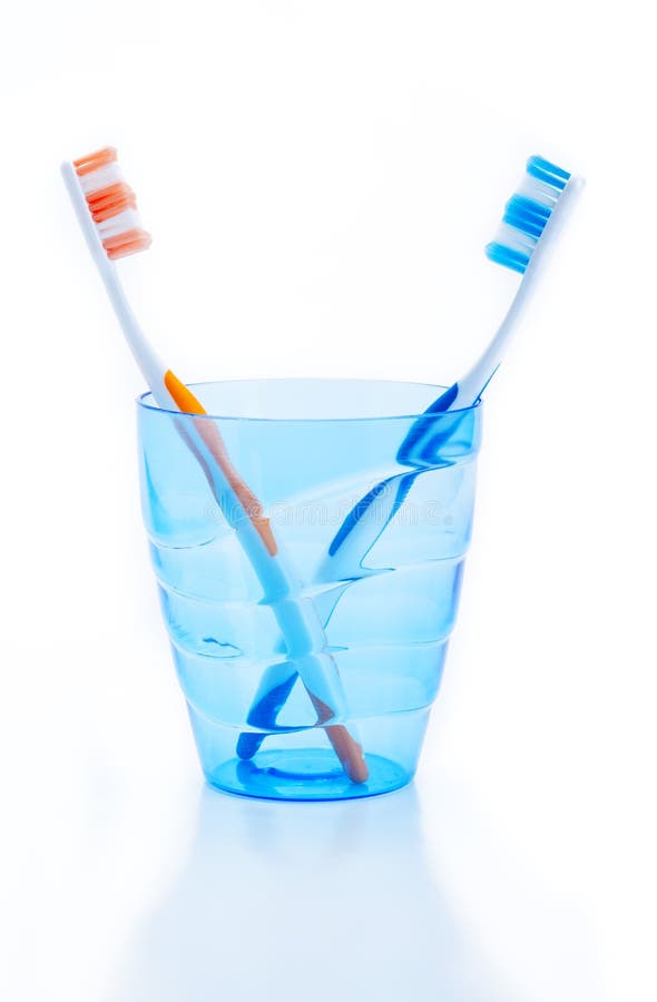 Toothbrushes in Blue Plastic Glass Stock Image - Image of couple, clean ...
