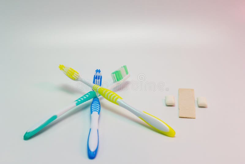 Toothbrushes and Chewing Gum on White Background.oral Freshness Stock ...