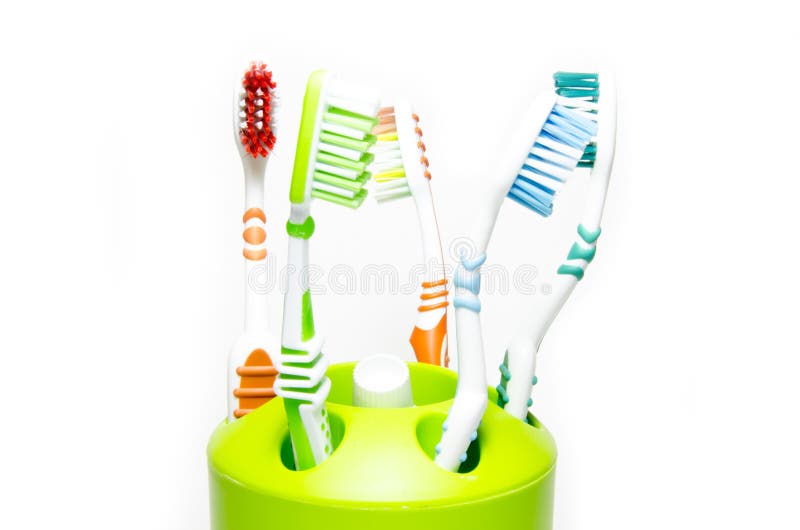 Red Container with Toothbrushes and Toothpaste on a Wooden Surface ...