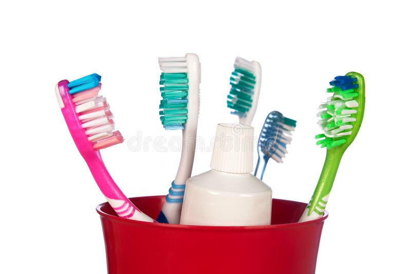 Toothbrushes in a cup stock photo. Image of personal - 16087992