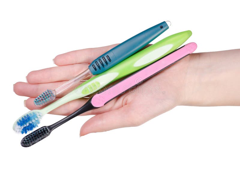 Toothbrushes in hand stock photo. Image of background - 108779218