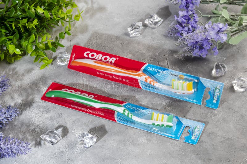 Toothbrushes in Plastic Packaging on a Gray Background. Ready for Sale ...