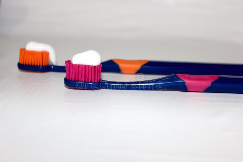 2 Toothbrushes on a White Background with Toothpaste. Toothpaste on a ...
