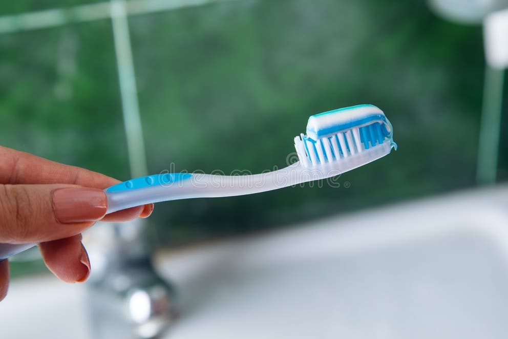 Toothpaste on the brush stock photo. Image of dental - 255828892