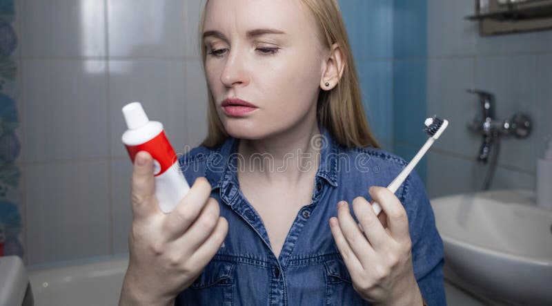 Toothpaste Ingredients. Girl Checks Composition of Toothpaste and is ...