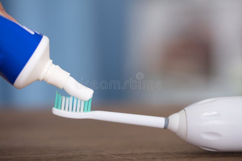 Toothpaste Squeezed on the Toothbrush Stock Photo - Image of squeezing ...