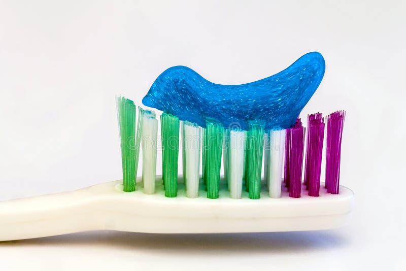 Toothpaste on a Toothbrush Close-up on a White Light Background Stock ...
