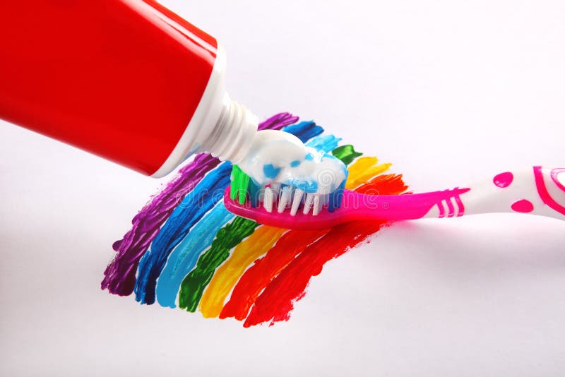 Toothpaste and Toothbrush on Rainbow Background Stock Image - Image of ...