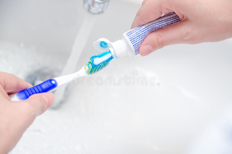 Toothpaste on a Toothbrush with Water Stock Image - Image of breath ...