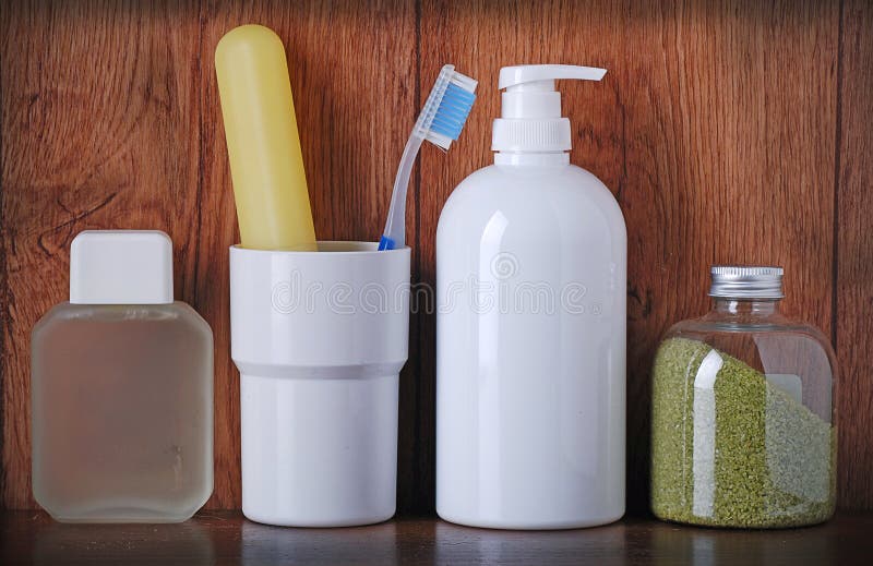 Toothpaste, Toothbrushes, Soap, Aftershave on Bathroom Shelf Stock ...